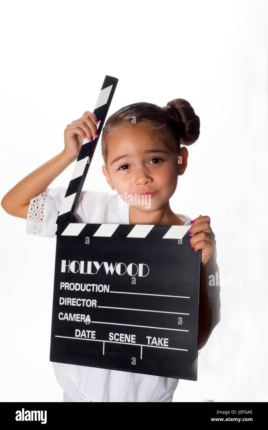 young girl modeling in studio with production slate Stock Photo - Alamy