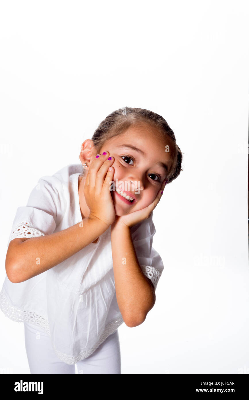 young girl modeling in studio looking at camera smiling Stock Photo - Alamy
