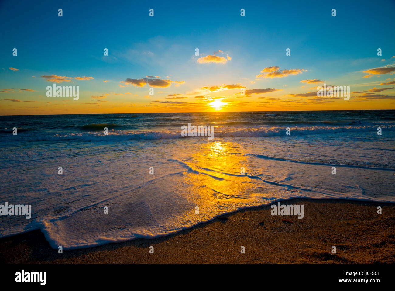 beach sunset over the ocean Stock Photo - Alamy