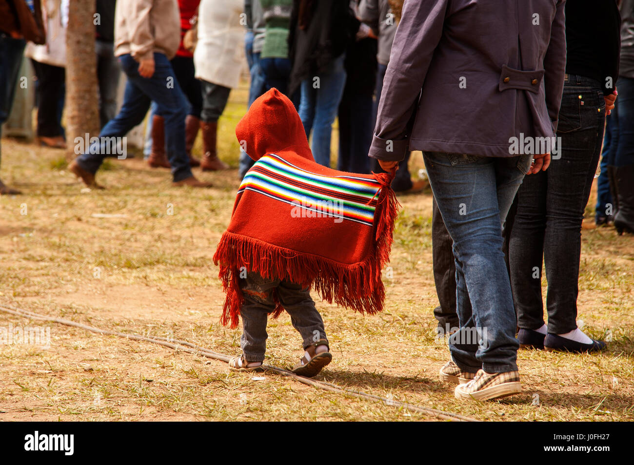 Wearing a poncho hi-res stock photography and images - Alamy