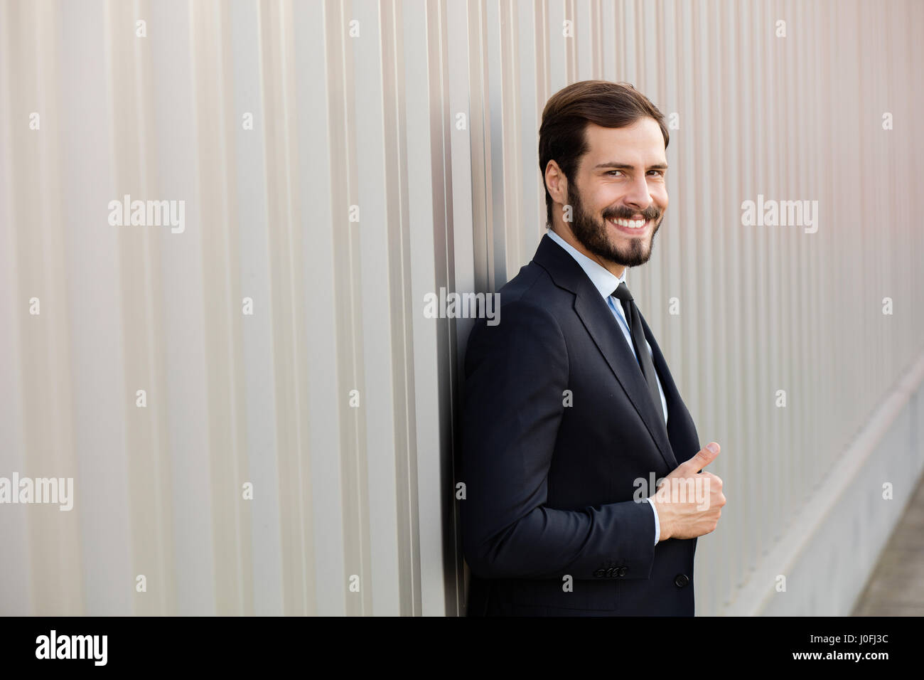Man in suit smiling at camera hi-res stock photography and images - Alamy