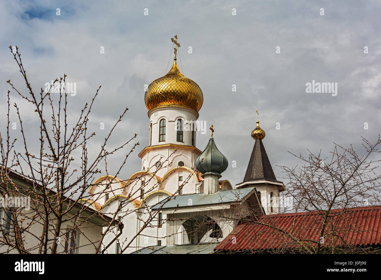 Belfry and gilded dome of the Church of St. Michael the Archangel Stock ...