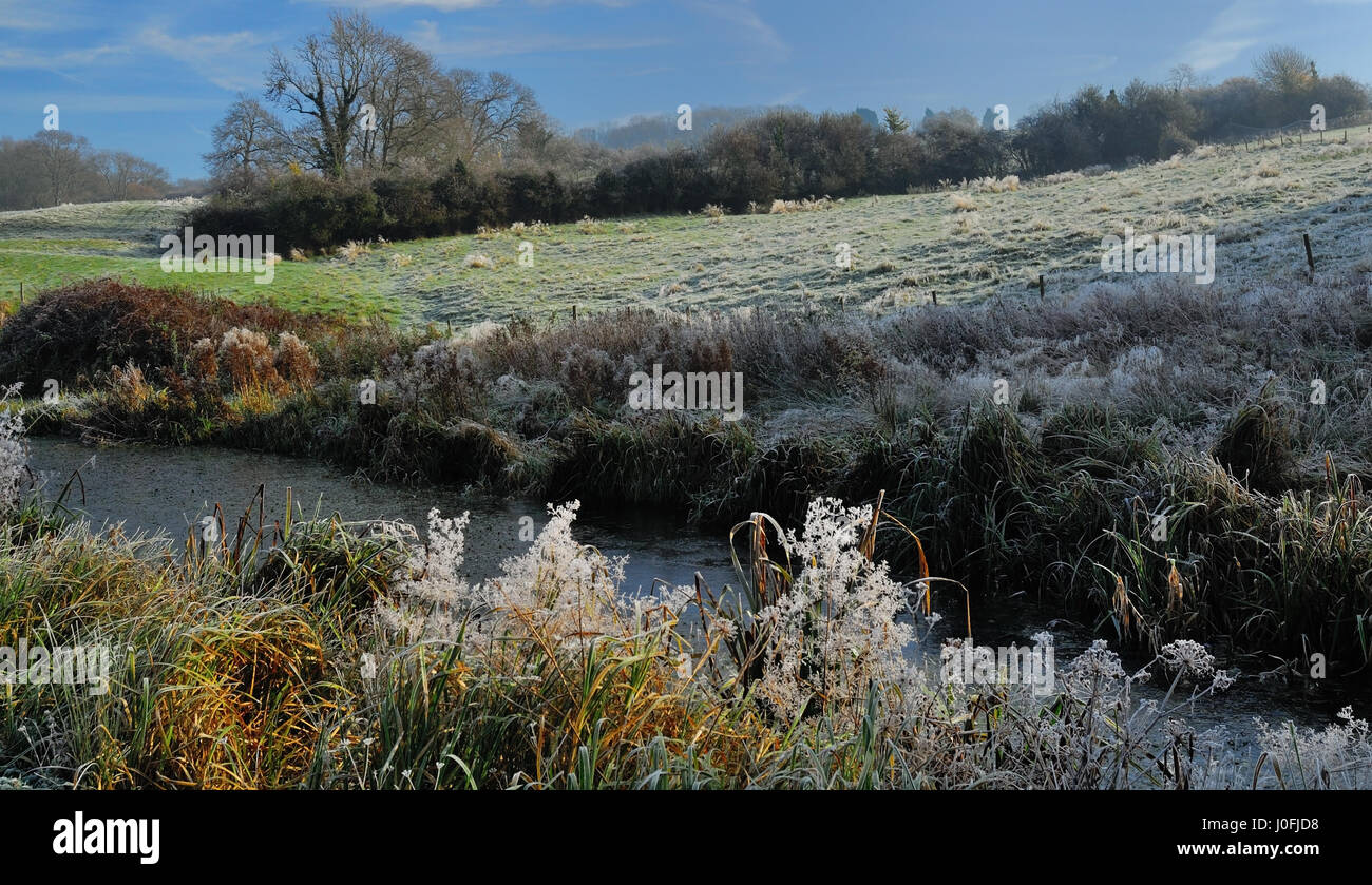 Late autumn sunshine over a frozen landscape Stock Photo - Alamy