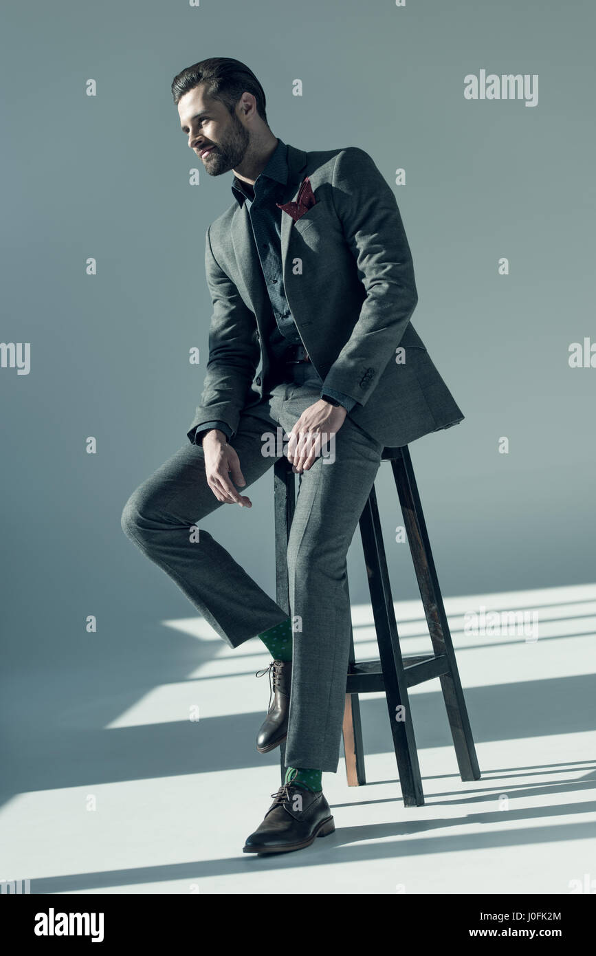 Man sitting side view suit hi-res stock photography and images - Alamy