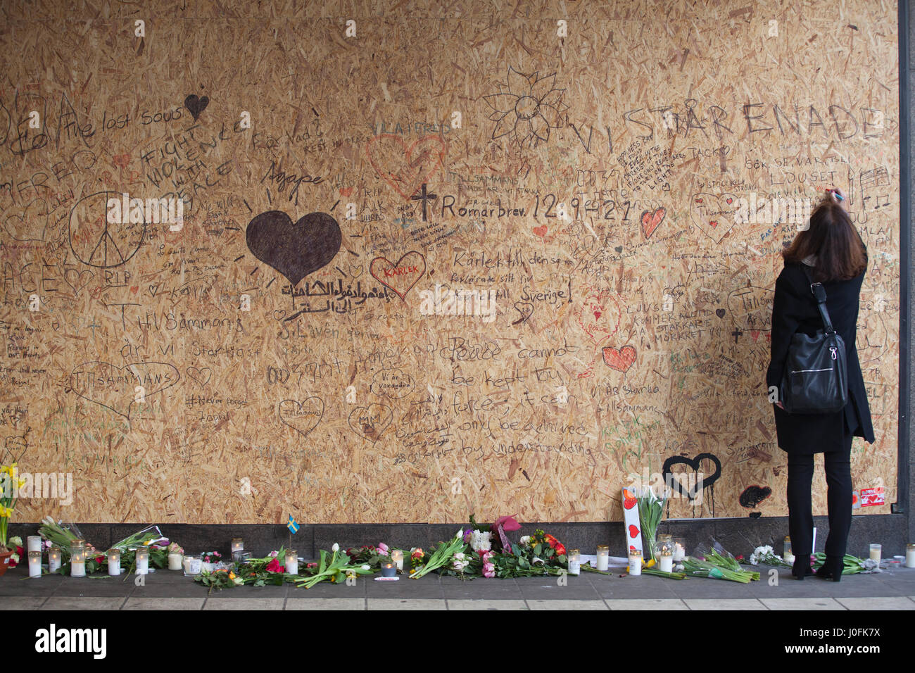 People sign a memorial wall after terrorist Rakhmat Akilov hijacked a ...