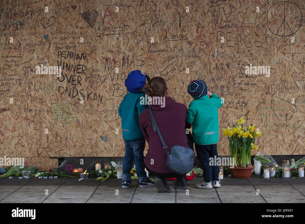 People sign a memorial wall after terrorist Rakhmat Akilov hijacked a ...