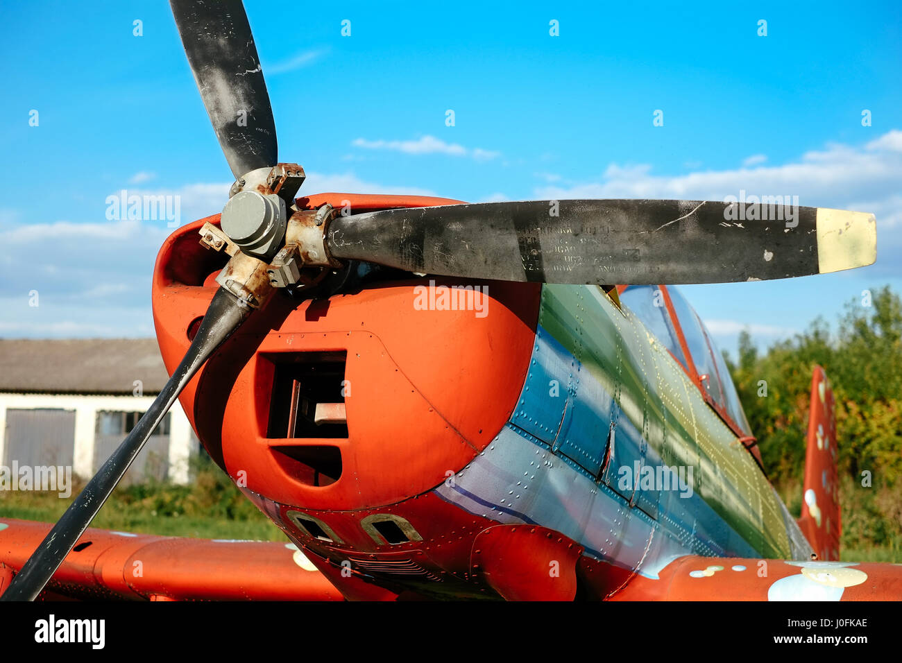 Colorfull airpane parked on the grass at the airfield Stock Photo - Alamy