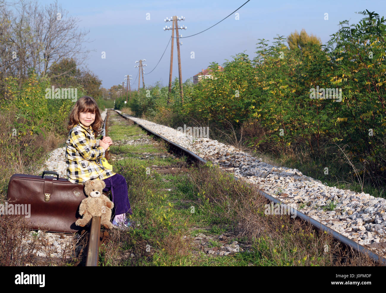 Beautiful girl on train tracks hi-res stock photography and images - Alamy
