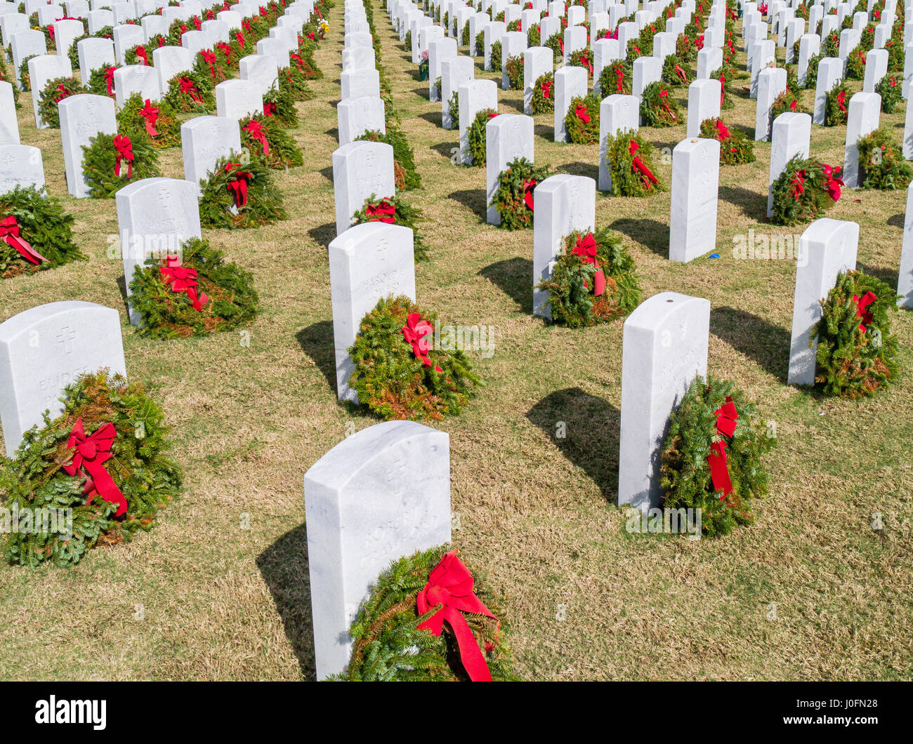Rows of grave stones with wreaths & red bows in Sarasota National ...
