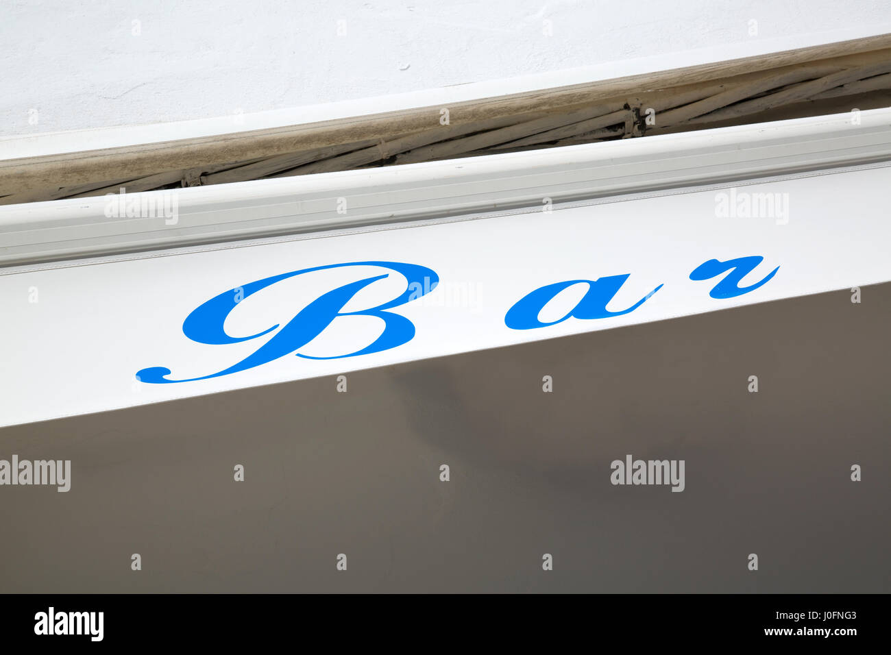 Blue Bar Sign on Building Facade Stock Photo - Alamy