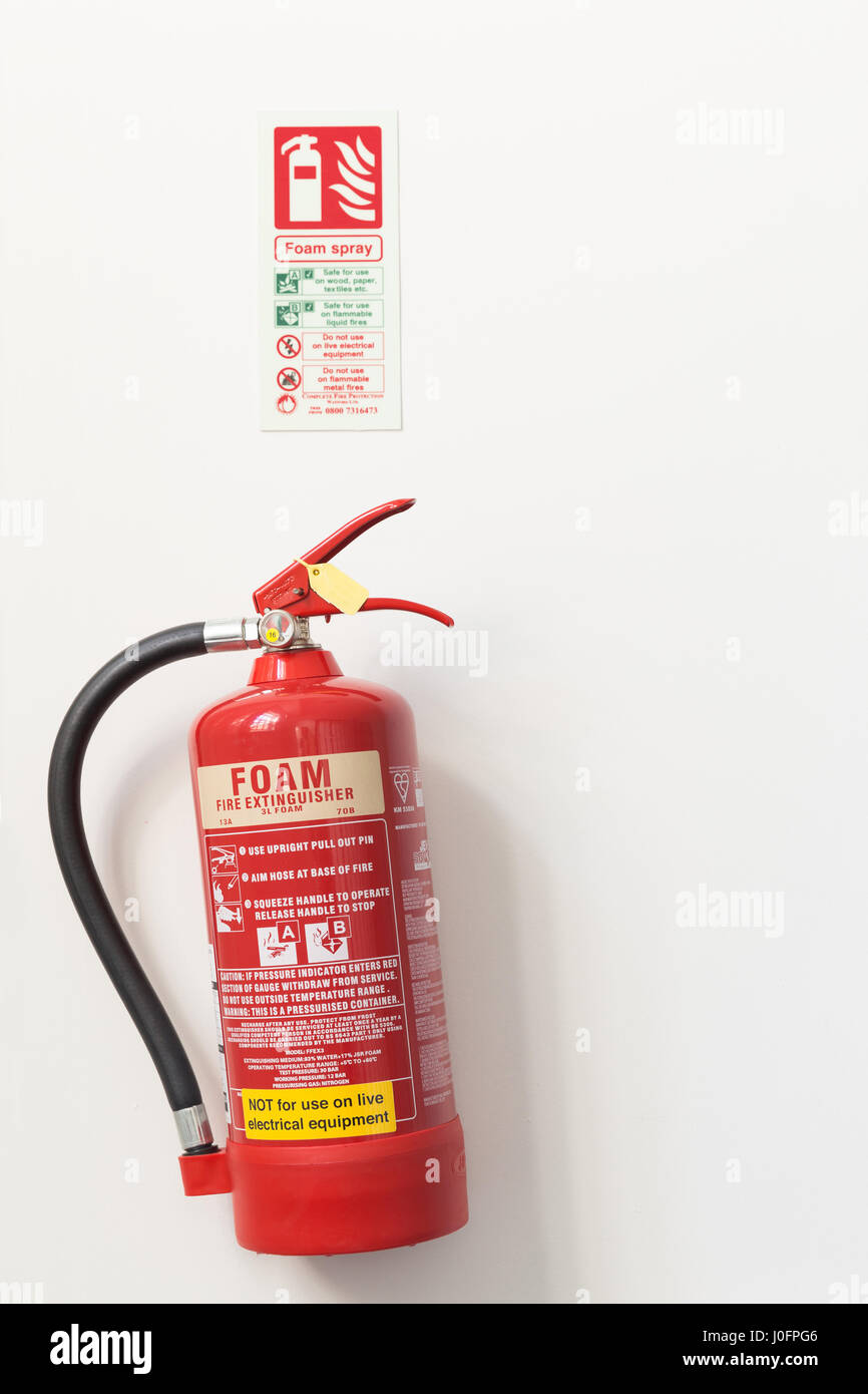 Fire extinguisher hanging on wall hi-res stock photography and images ...