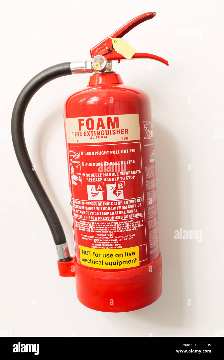 Fire extinguisher hanging on wall hi-res stock photography and images ...