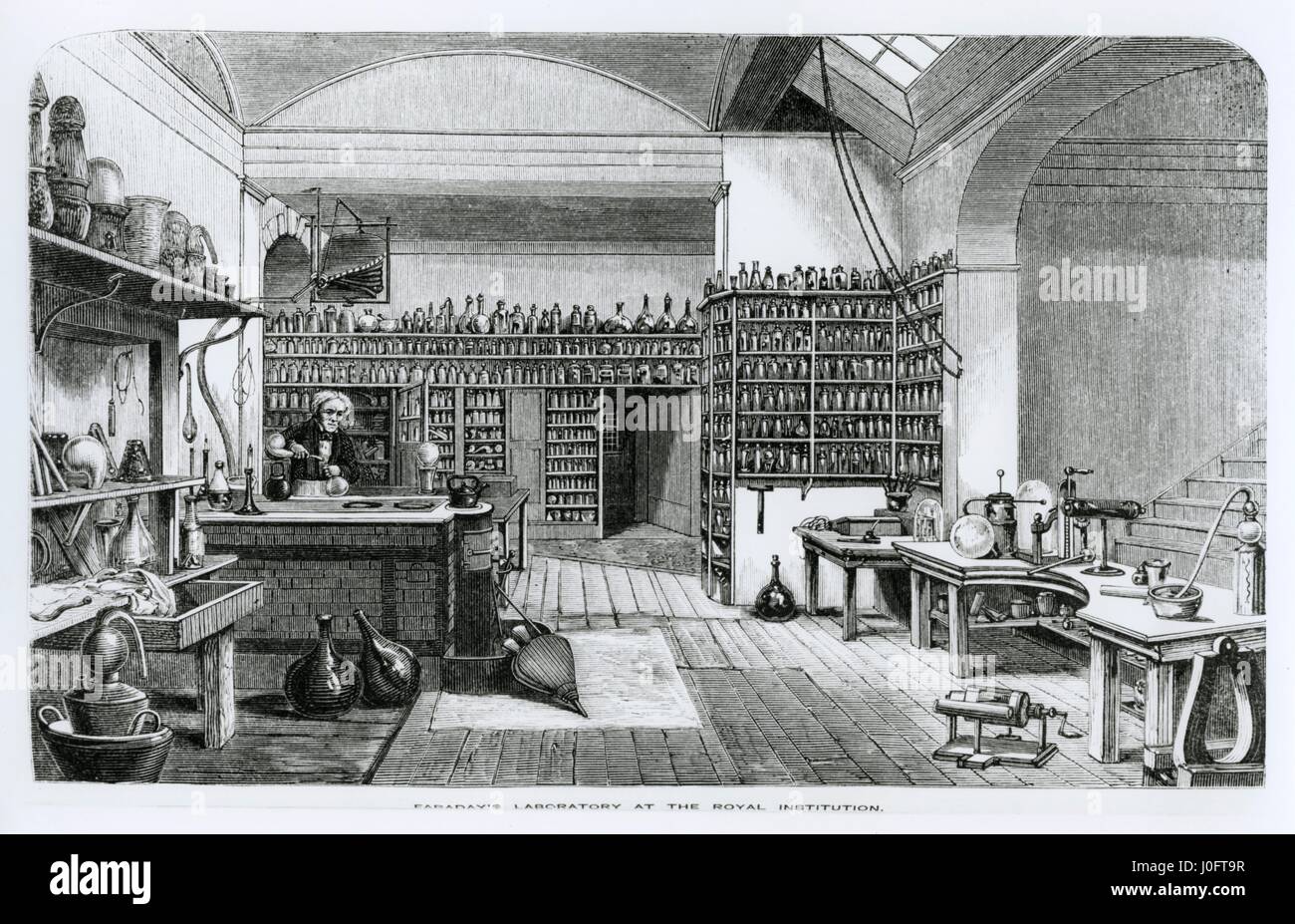 Michael Faraday in his laboratory at the Royal Institution Stock Photo ...