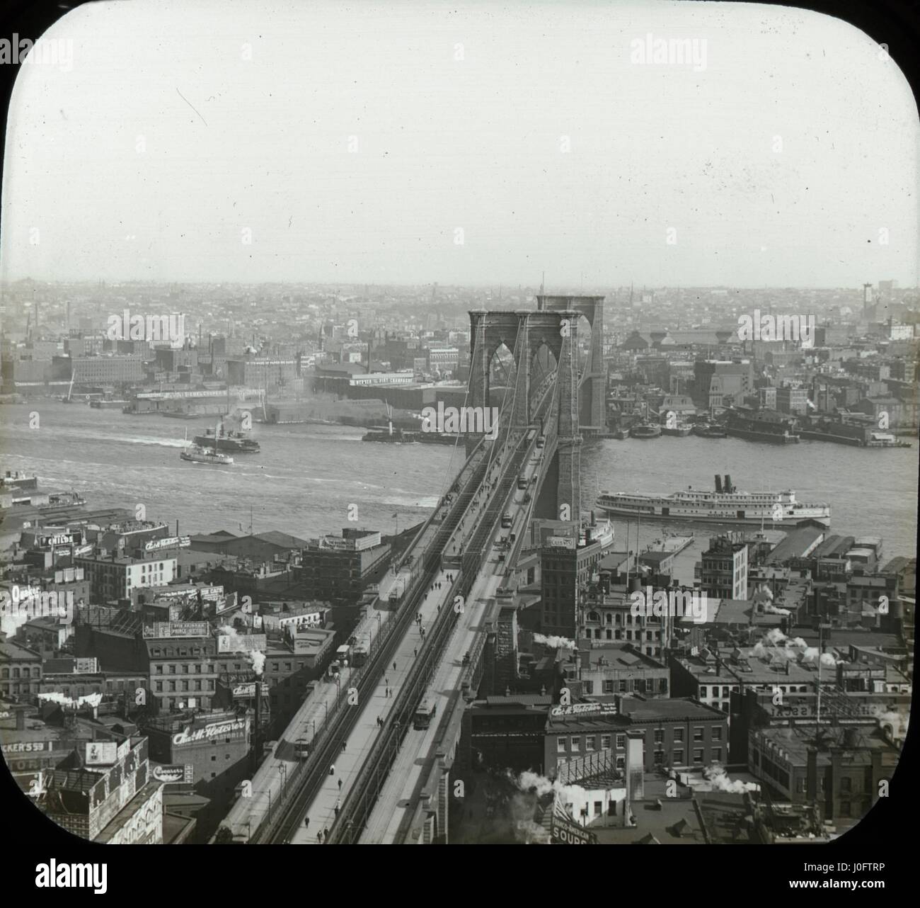 Aerial view of the Brooklyn Bridge with buildings on each side of its ...