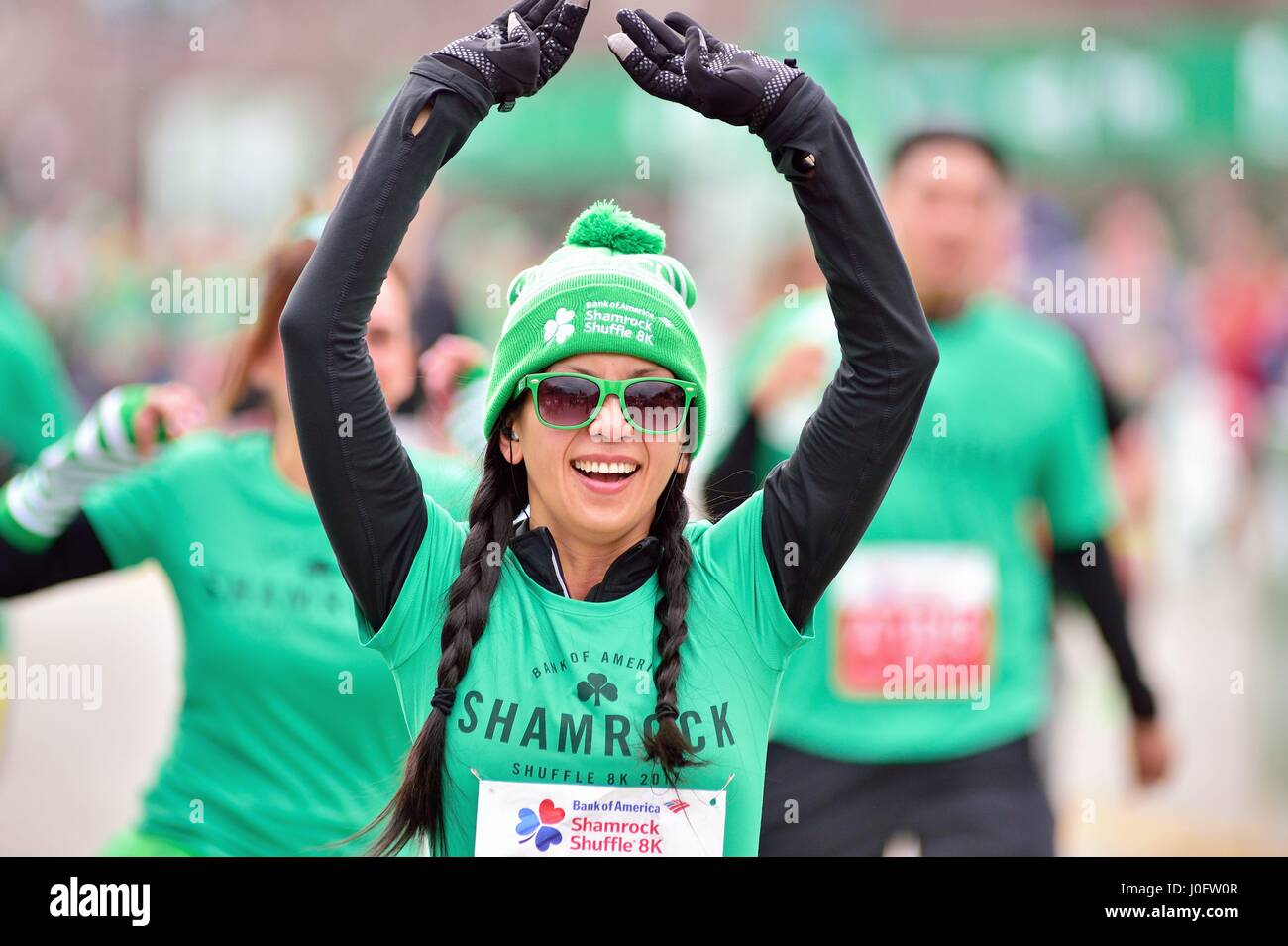 Very happy runner crossing the finish line at the 2017 Shamrock Shuffle ...