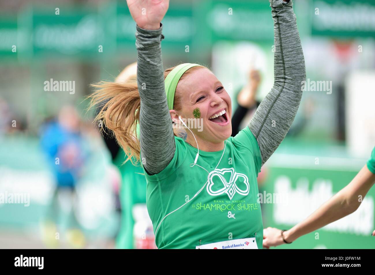 Very happy runner crossing the finish line at the 2017 Shamrock Shuffle ...