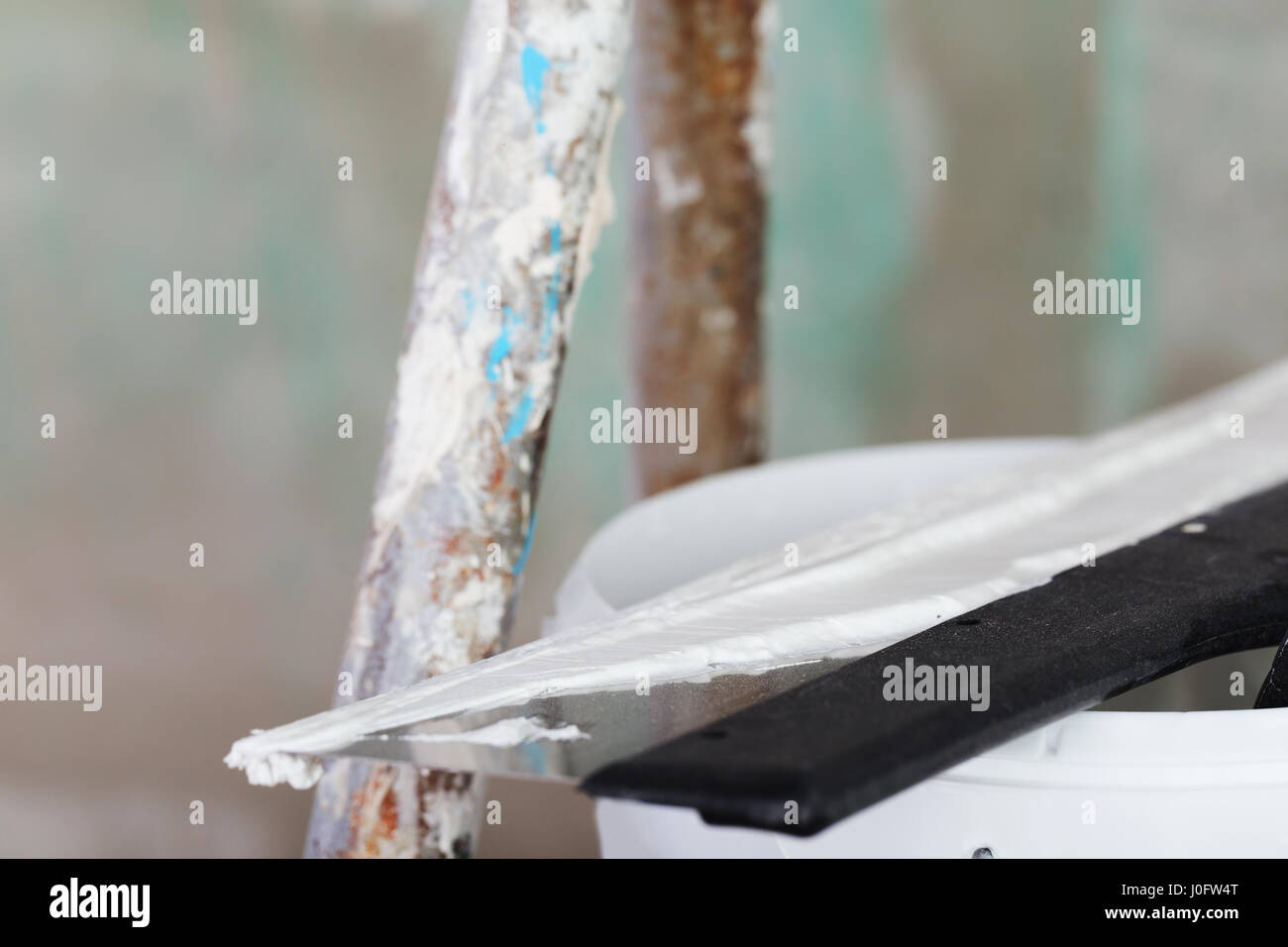 house improvement. stucco bucket and plastering trowel Stock Photo - Alamy