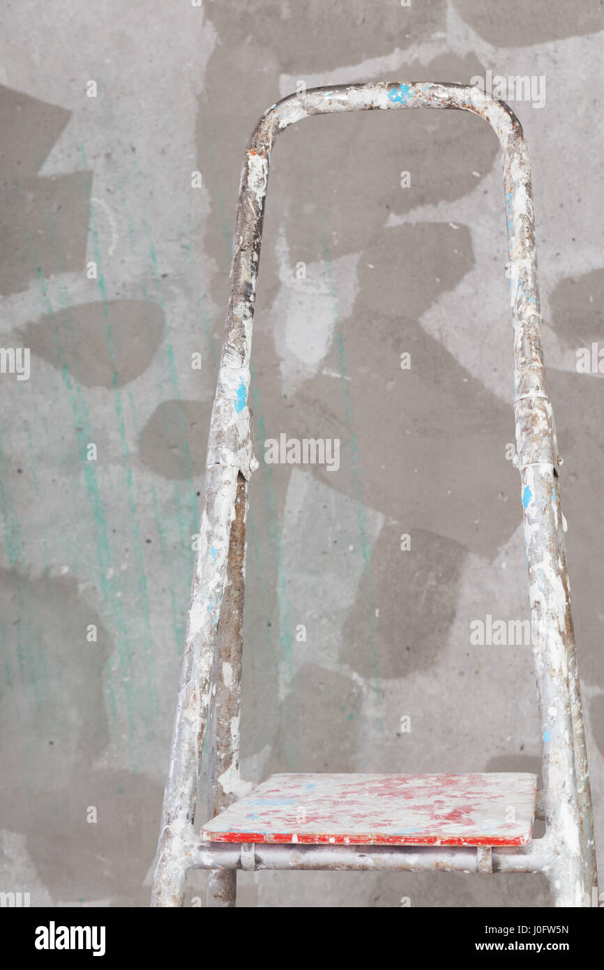 Old painted and stucco ladder on concrete wall background Stock Photo ...