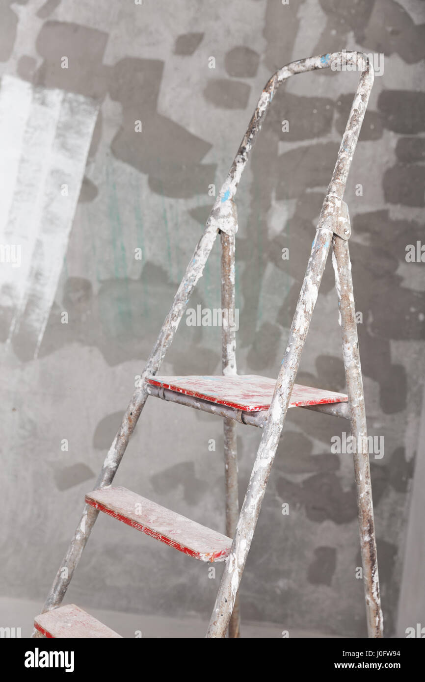 Old painted and stucco ladder on a concrete wall background Stock Photo ...