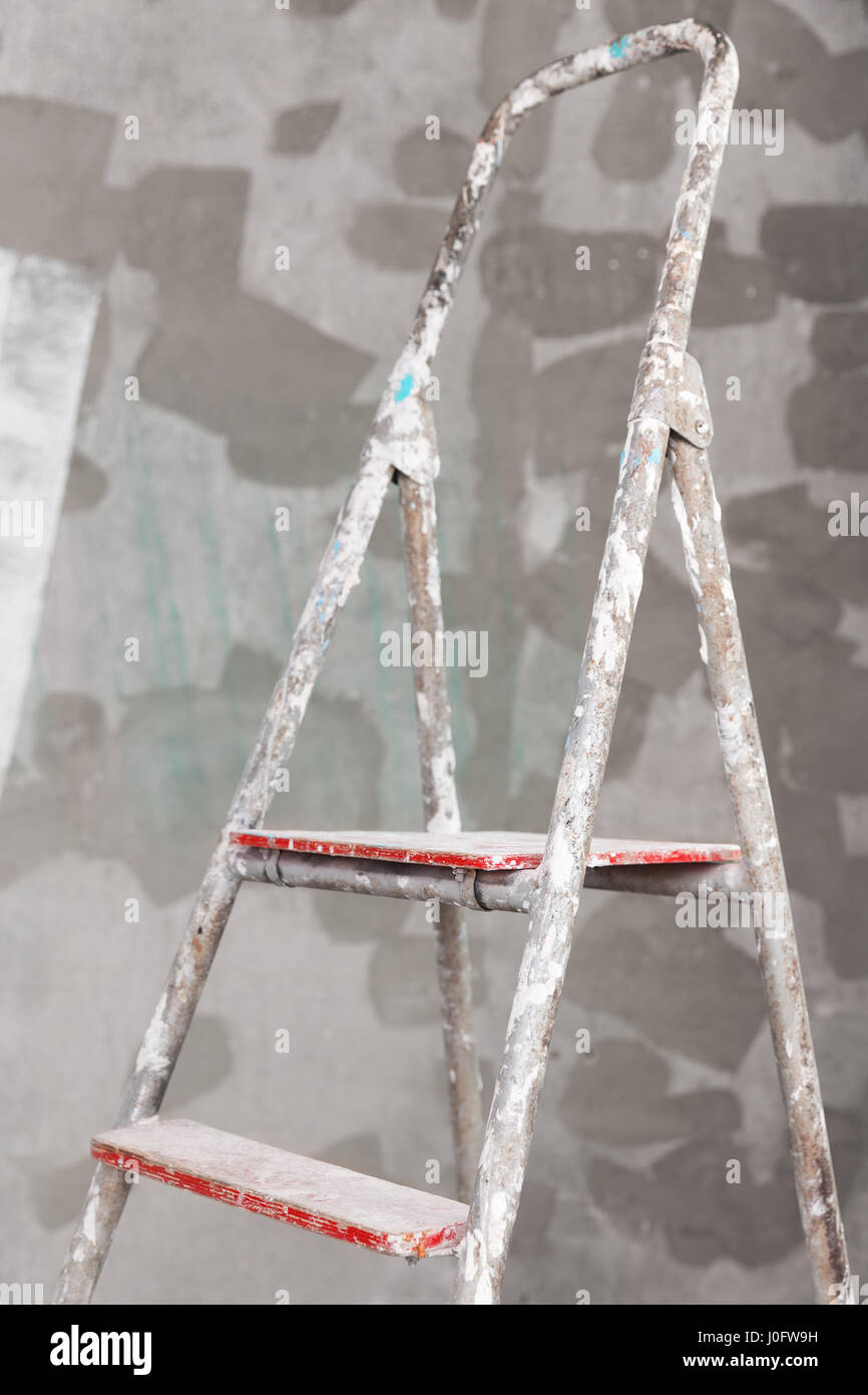 Old painted and stucco ladder on concrete wall background Stock Photo ...