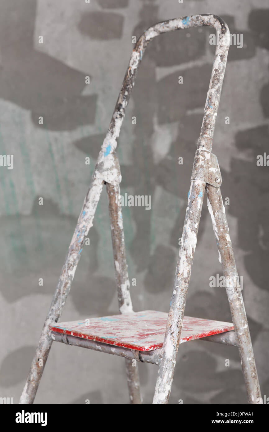 Old painted and stucco ladder on concrete wall background Stock Photo ...