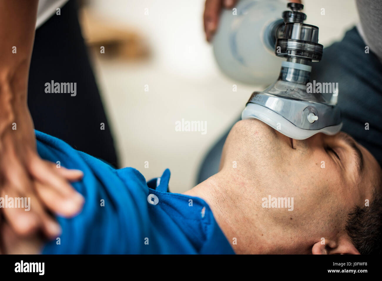 a girl helping a guy after heart attack with cardiopulmonary ...