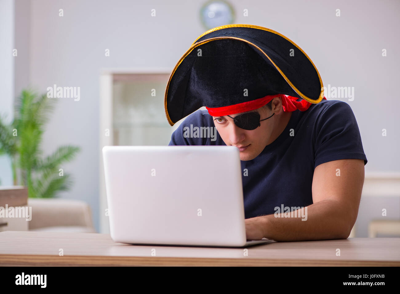 Digital security concept with pirate at computer Stock Photo - Alamy