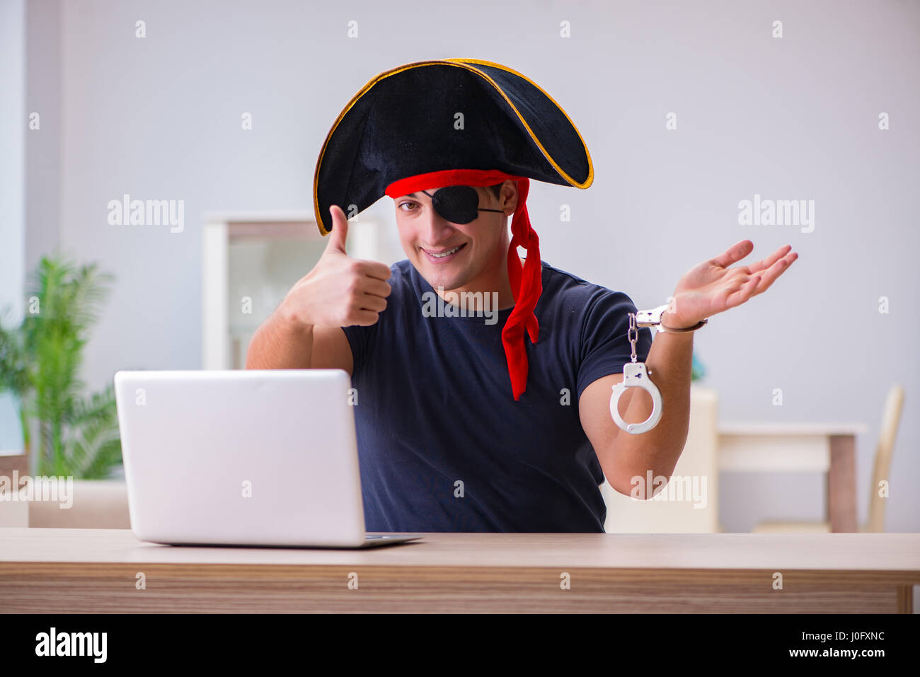 Digital security concept with pirate at computer Stock Photo - Alamy