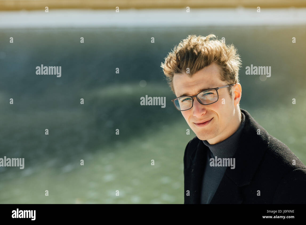smart goodlooking man wearing sunglasses standing outside with black ...
