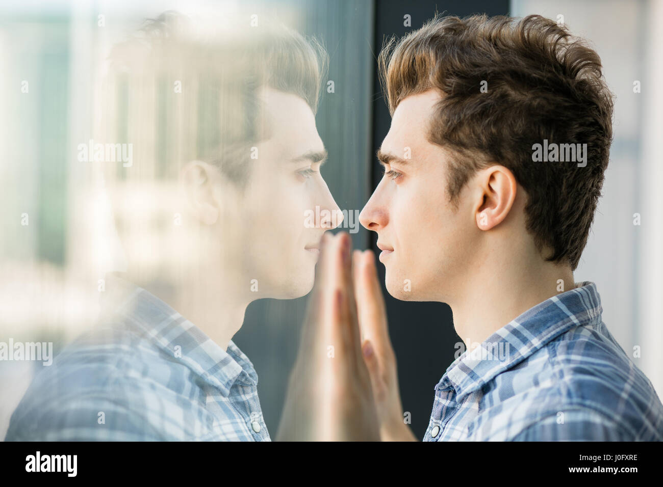 Man sitting large window in hi-res stock photography and images - Alamy
