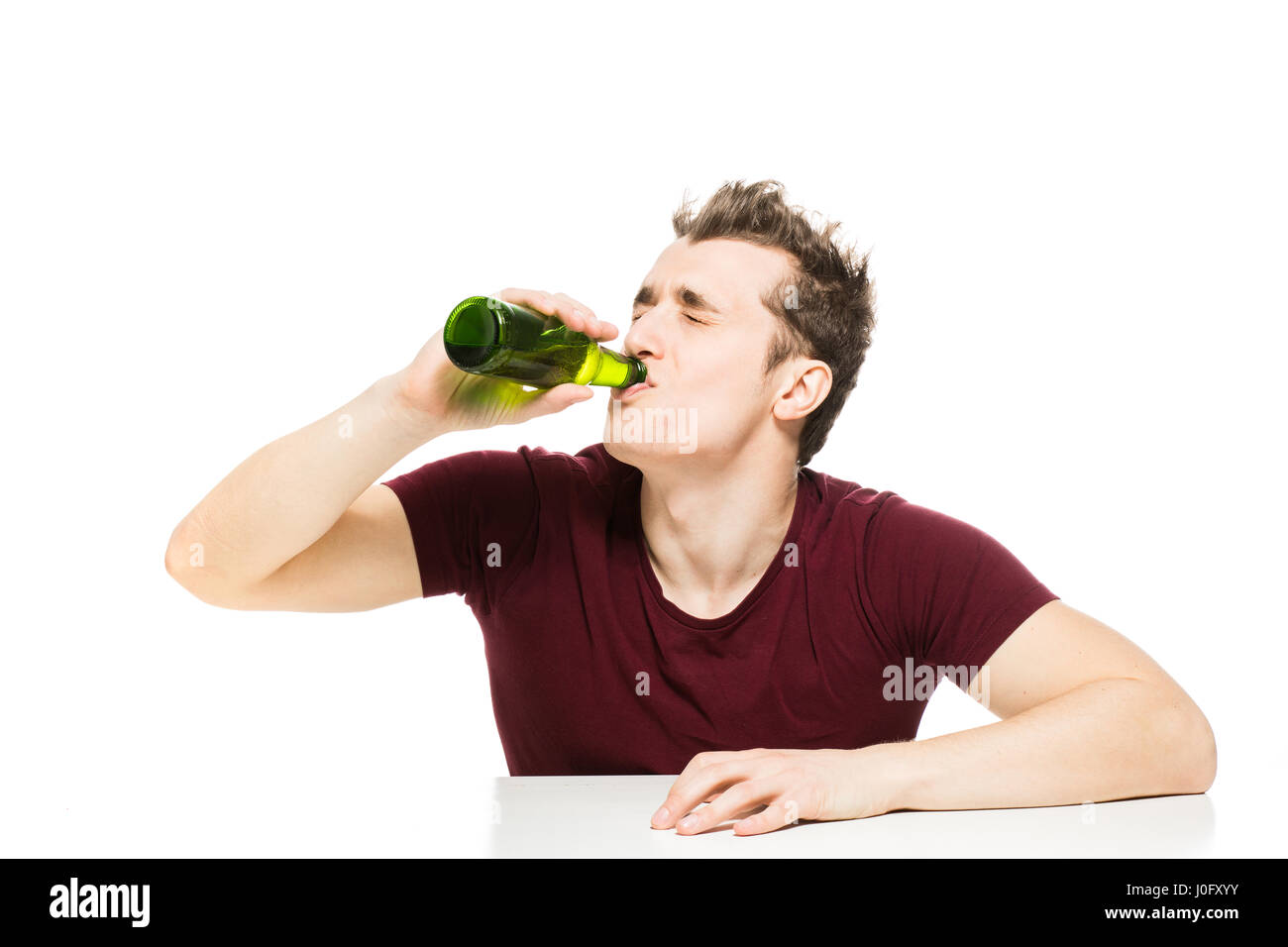 Man drinking beer from bottle hi-res stock photography and images - Alamy