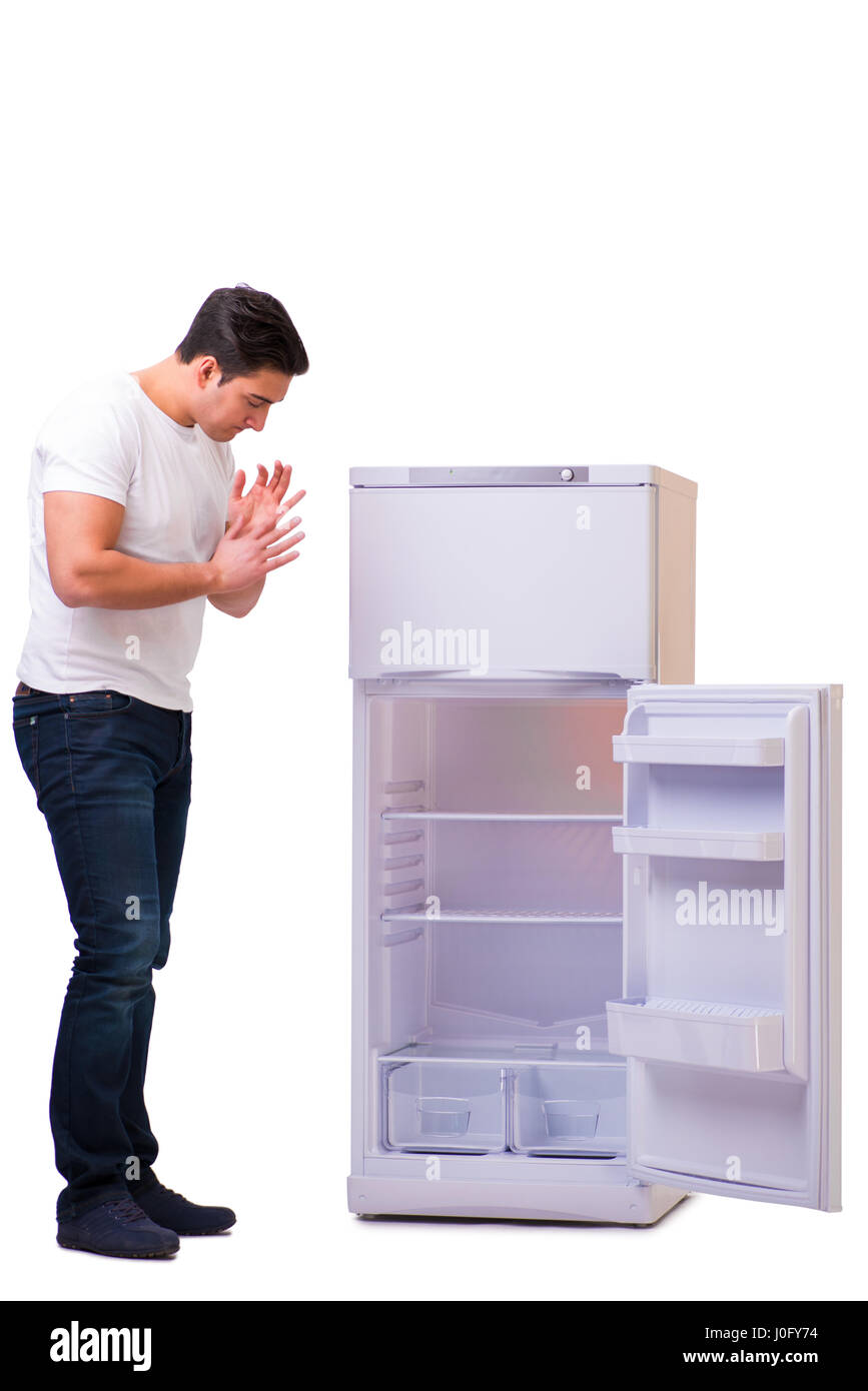 Man looking for food in empty fridge Stock Photo - Alamy