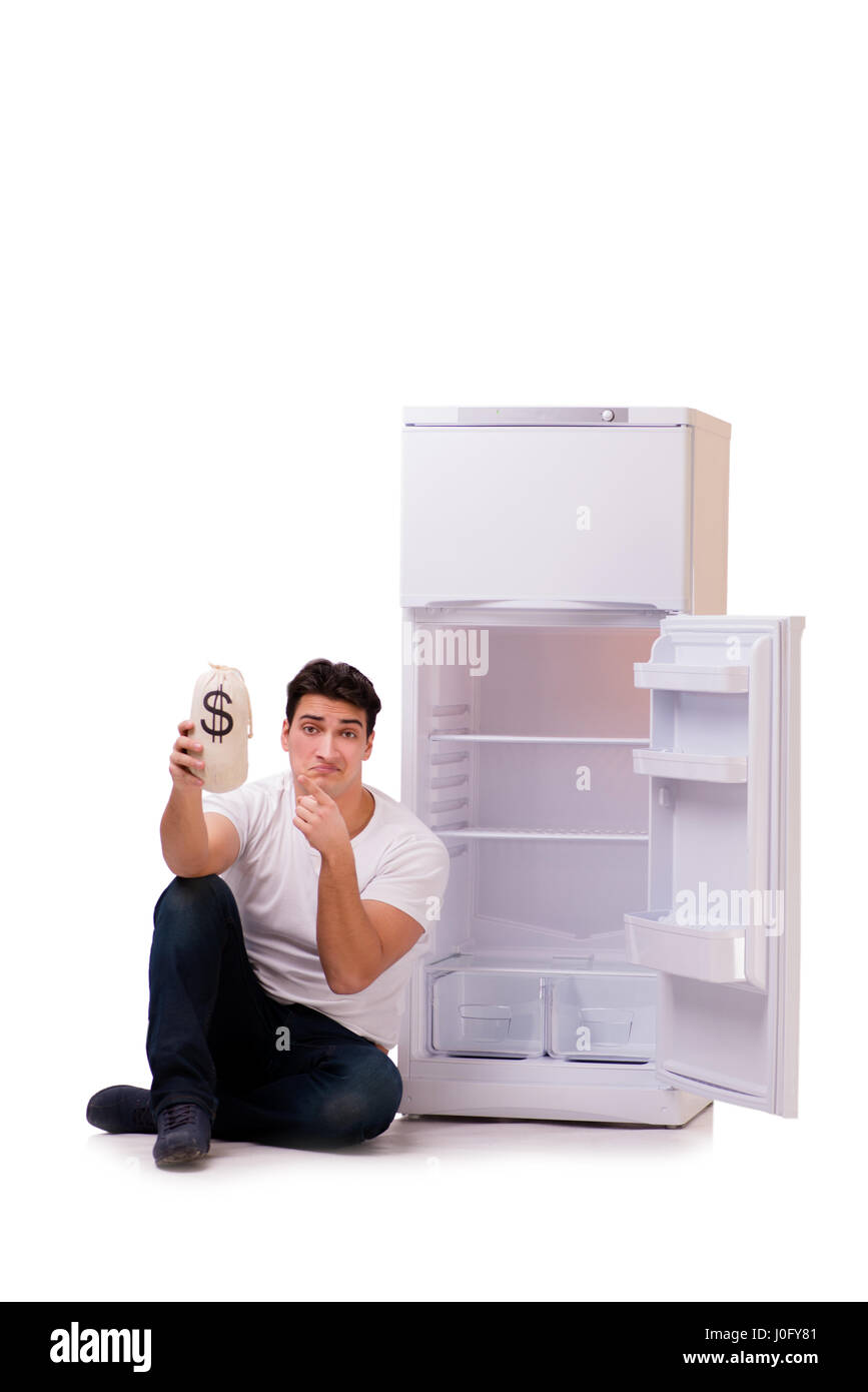 Hungry man looking for money to fill the fridge Stock Photo - Alamy