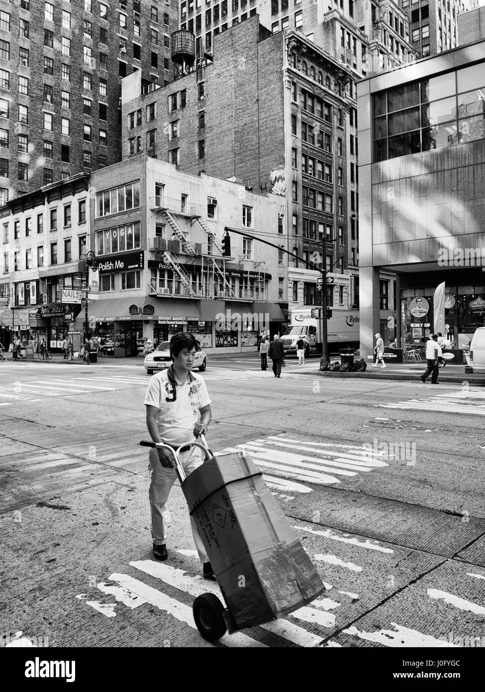 Man delivering a packet in Manhattan Stock Photo - Alamy