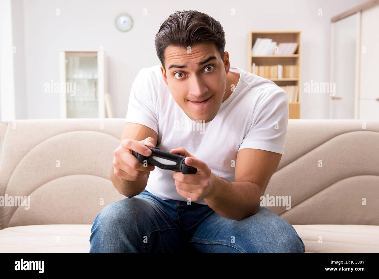 Man addicted to computer games Stock Photo - Alamy