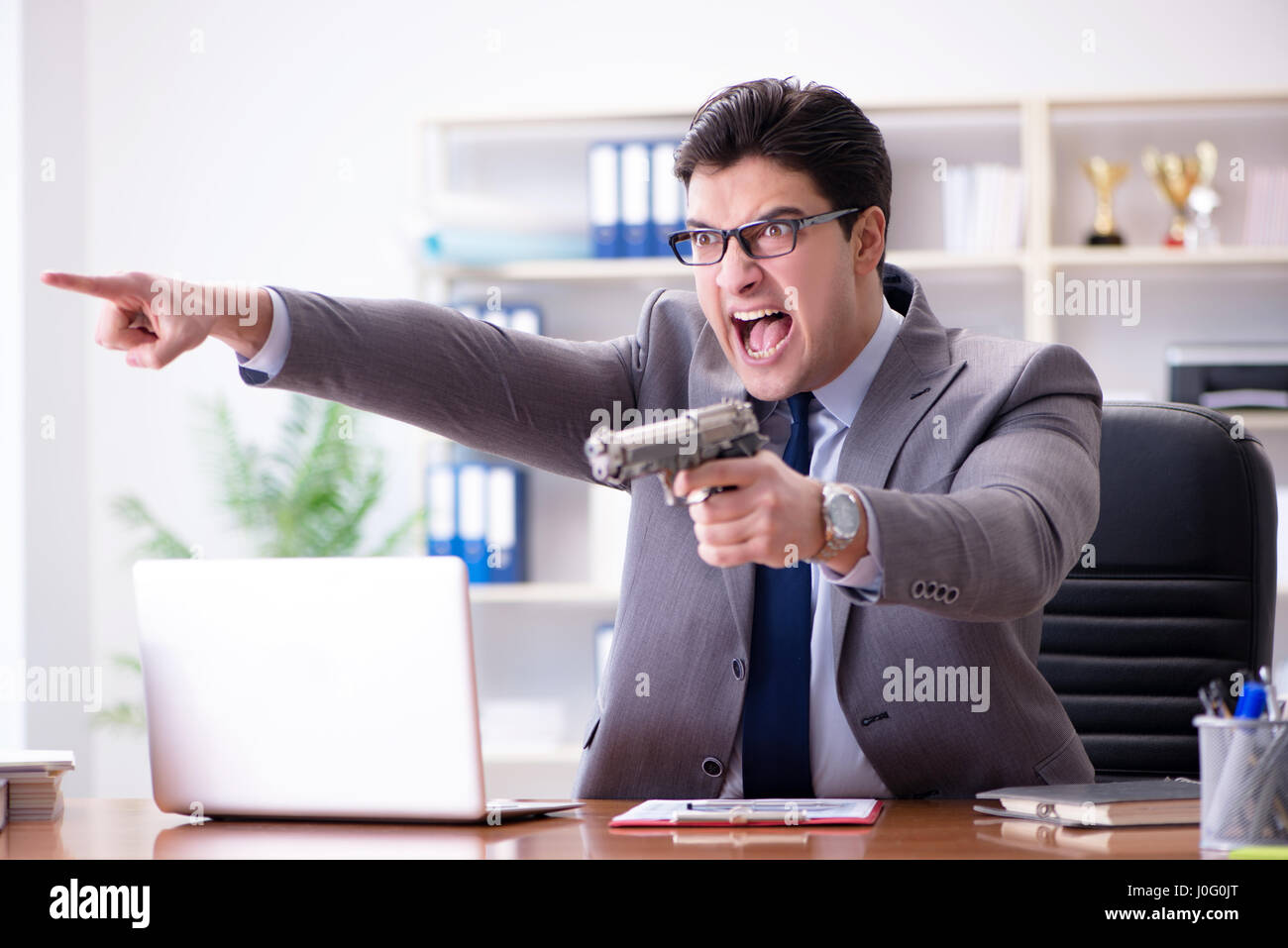 Angry aggressive businessman in the office Stock Photo - Alamy