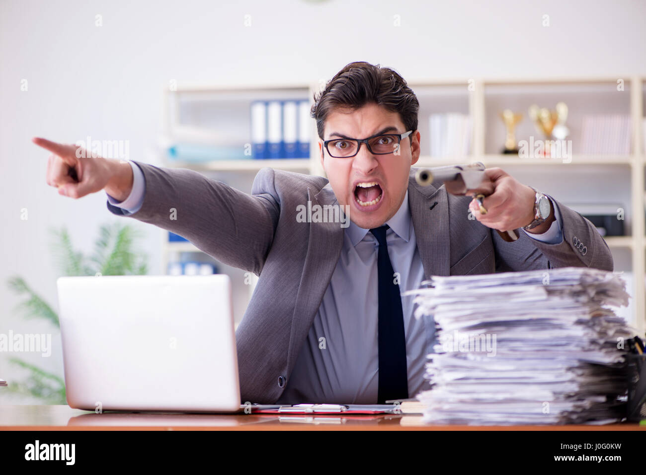 Angry aggressive businessman in the office Stock Photo - Alamy