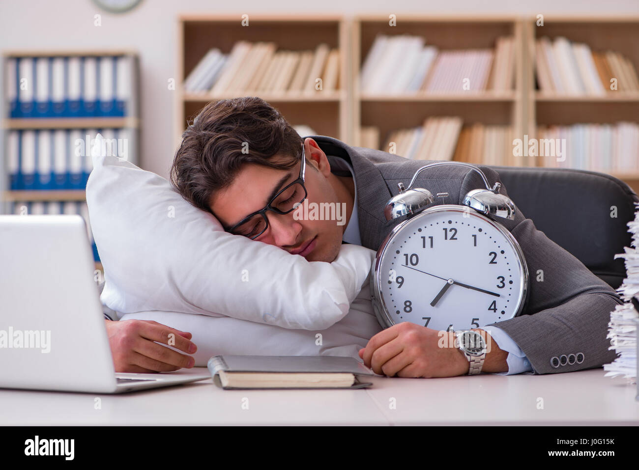 Tired man sleeping at home having too much work Stock Photo - Alamy