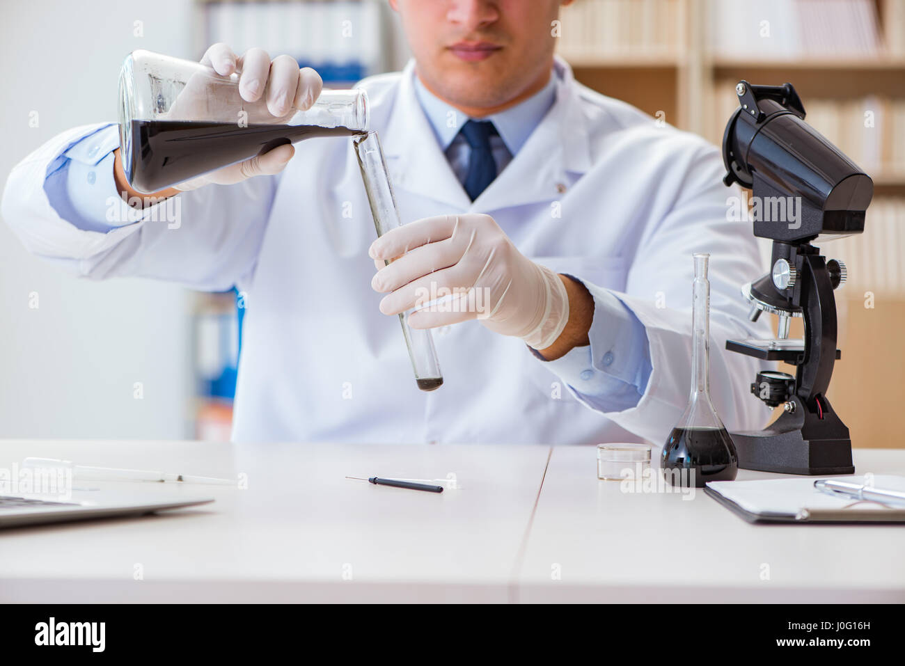 Chemical engineer working on oil samples in lab Stock Photo - Alamy