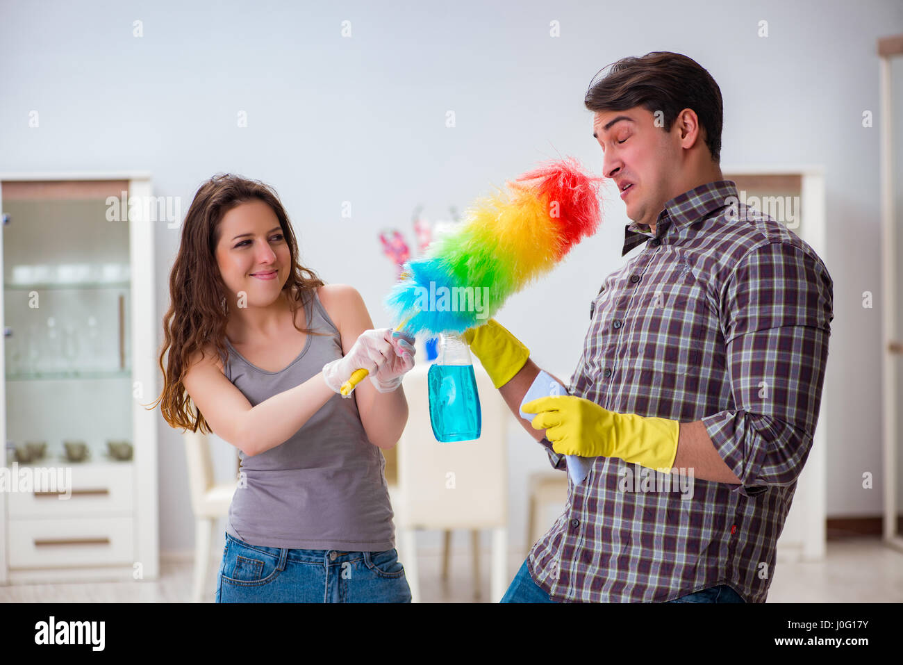Wife and husband doing cleaning at home Stock Photo - Alamy