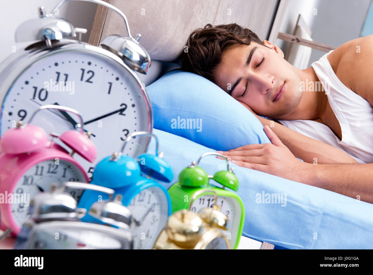Man having trouble waking up in morning Stock Photo - Alamy