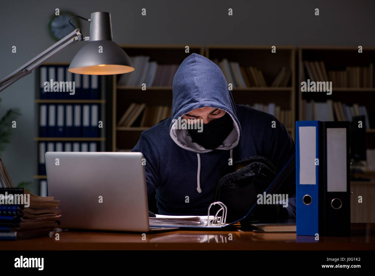 Hacker stealing personal data from home computer Stock Photo - Alamy
