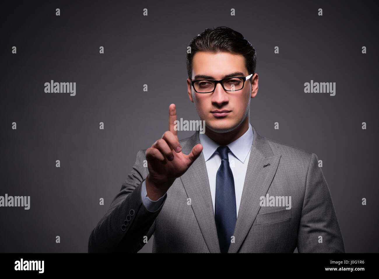 Handsome businessman pressing virtual buttons Stock Photo - Alamy Handsome businessman pressing virtual buttons Stock Photo - Alamy