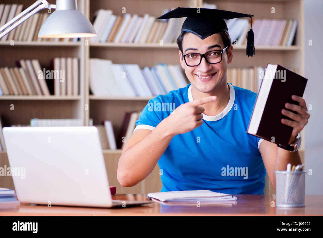 Young man graduating from university Stock Photo - Alamy