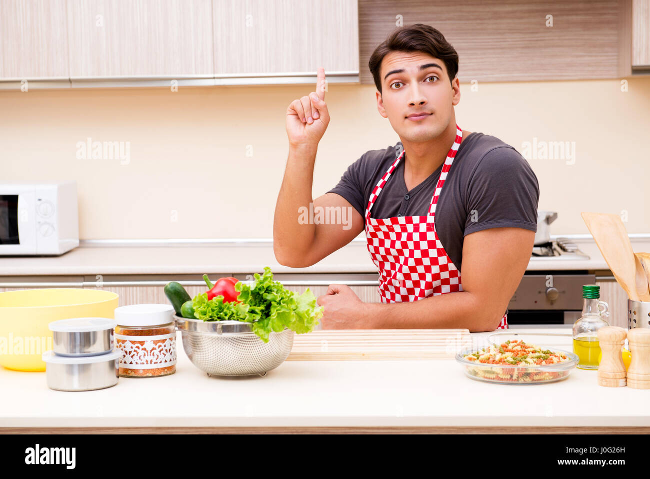 Man male cook preparing food in kitchen Stock Photo - Alamy
