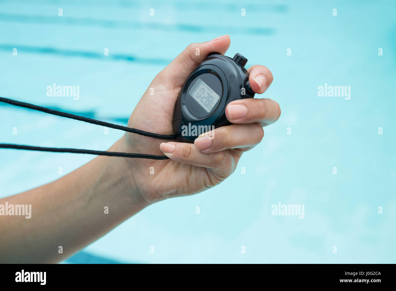 Hand holding stopwatch hi-res stock photography and images - Alamy