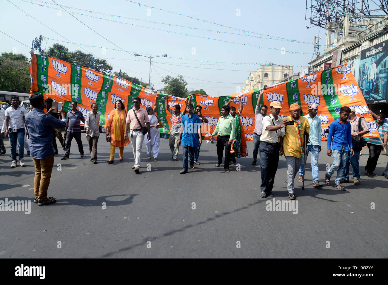 Kolkata, India. 12th Apr, 2017. BJP activist rally with huge BJP flag ...