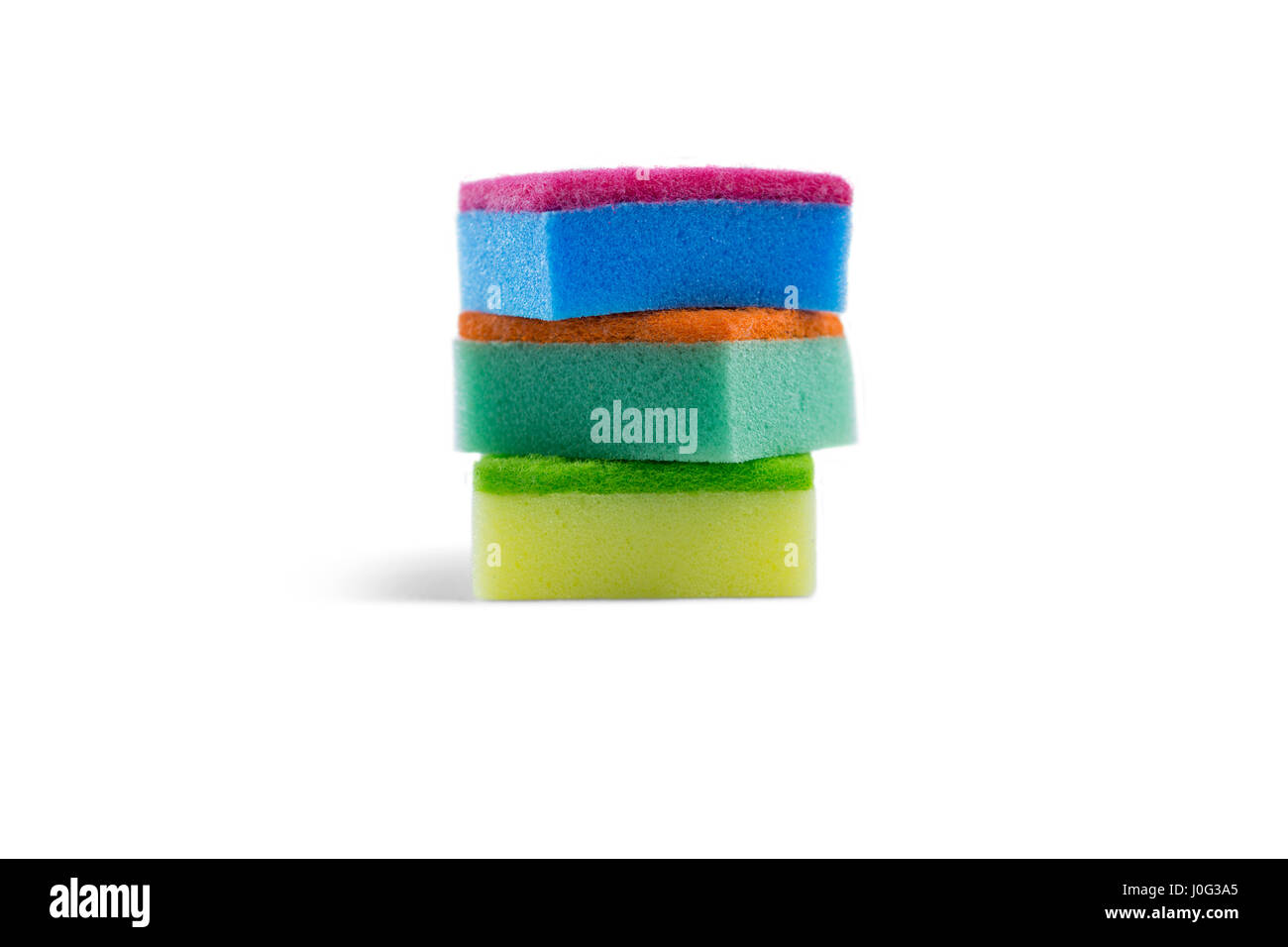 Close up of colorful sponge stacked against white background Stock ...