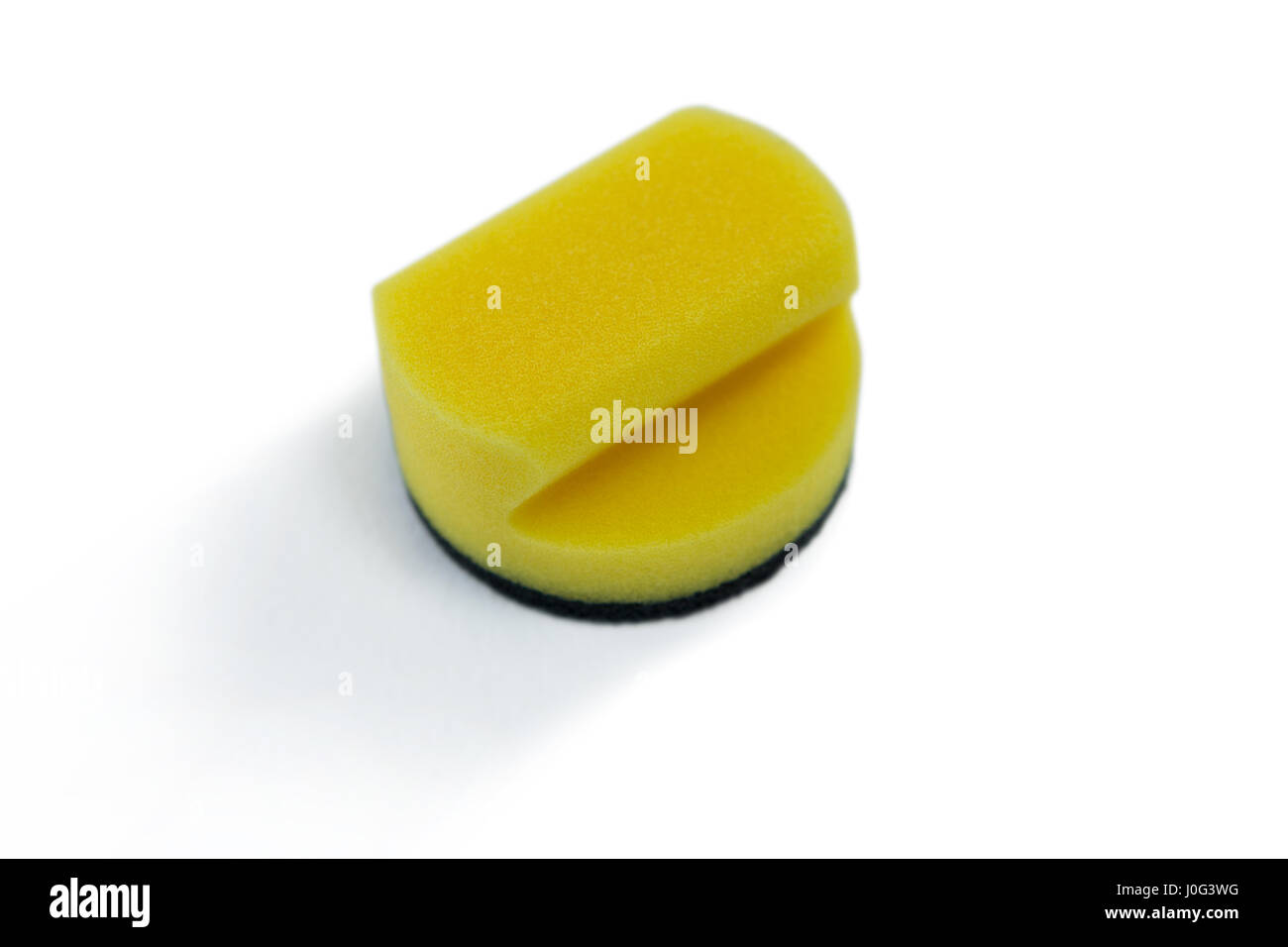 Close up of cleaning sponge against white background Stock Photo - Alamy