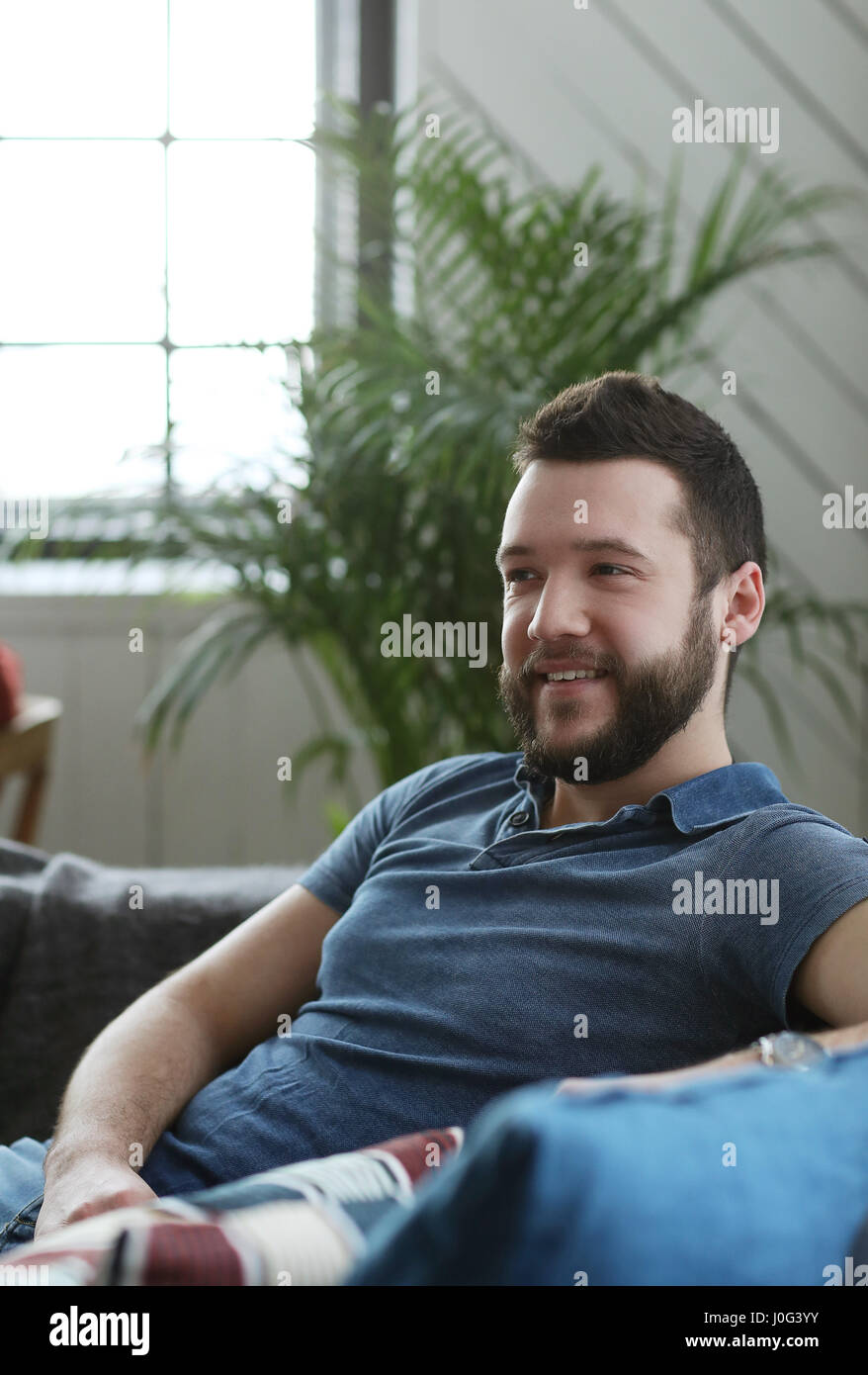 Lifestyle. Handsome man at home Stock Photo - Alamy